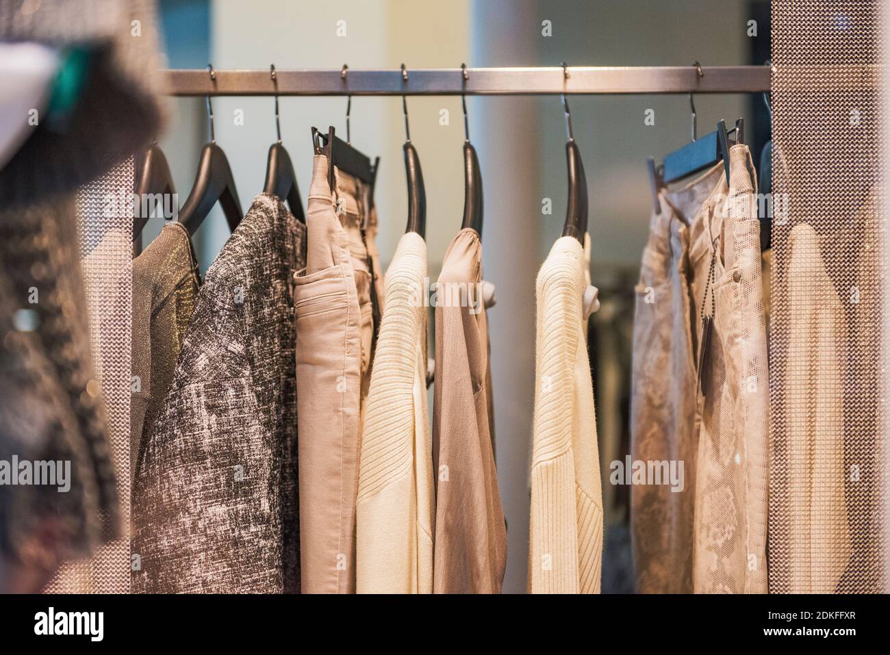Women clothing on hangers in a mall - shopping in mall concept Stock ...