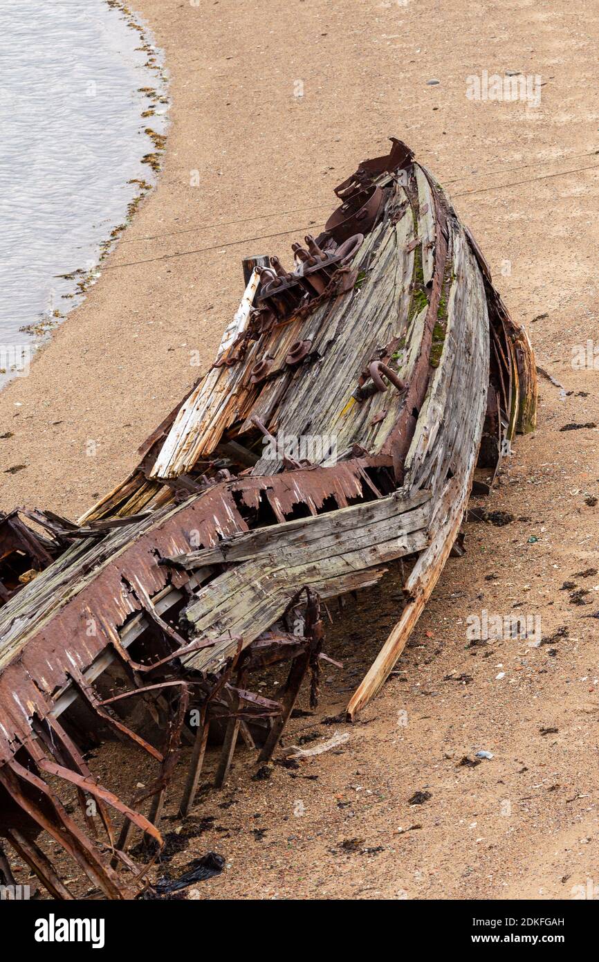 Rotting, abandoned ship on the shore, a symbol of decadence and ...