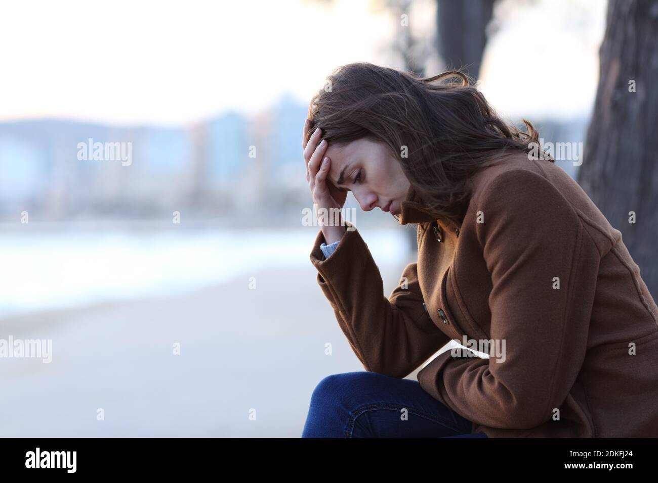 Sad lonely person on a bench hi-res stock photography and images - Alamy