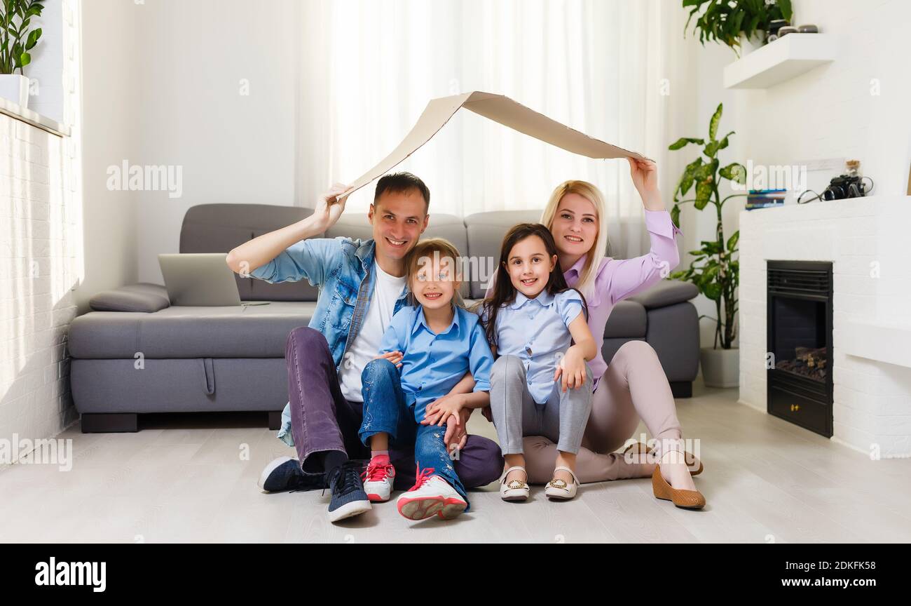 Portrait of a happy family smiling at home Stock Photo - Alamy