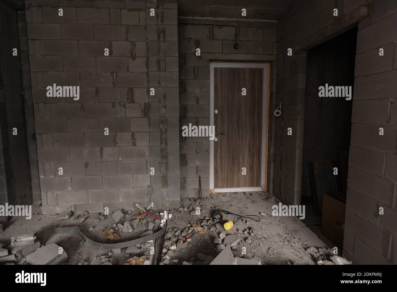 Wall smashed into debris room in apartment ready for renovation with ...