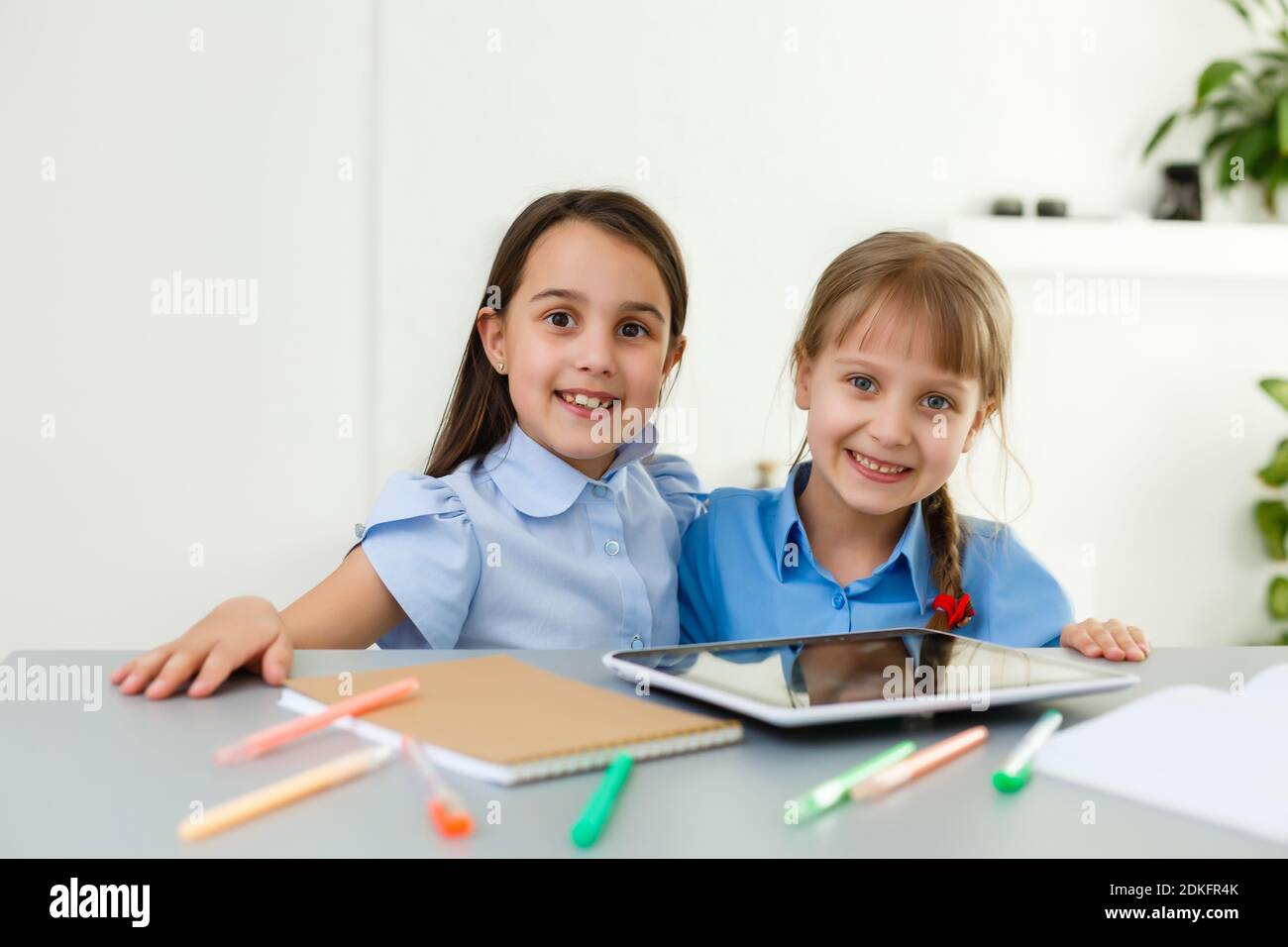 two little girls studying online. Distance Learning Online, e-learning ...