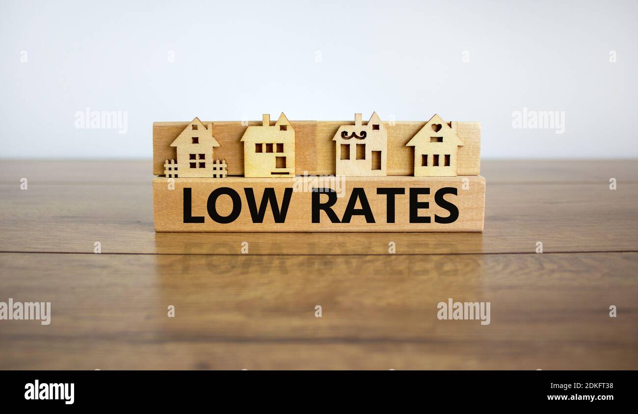Low rates symbol. Wooden blocks form the words 'loe rates', miniature ...