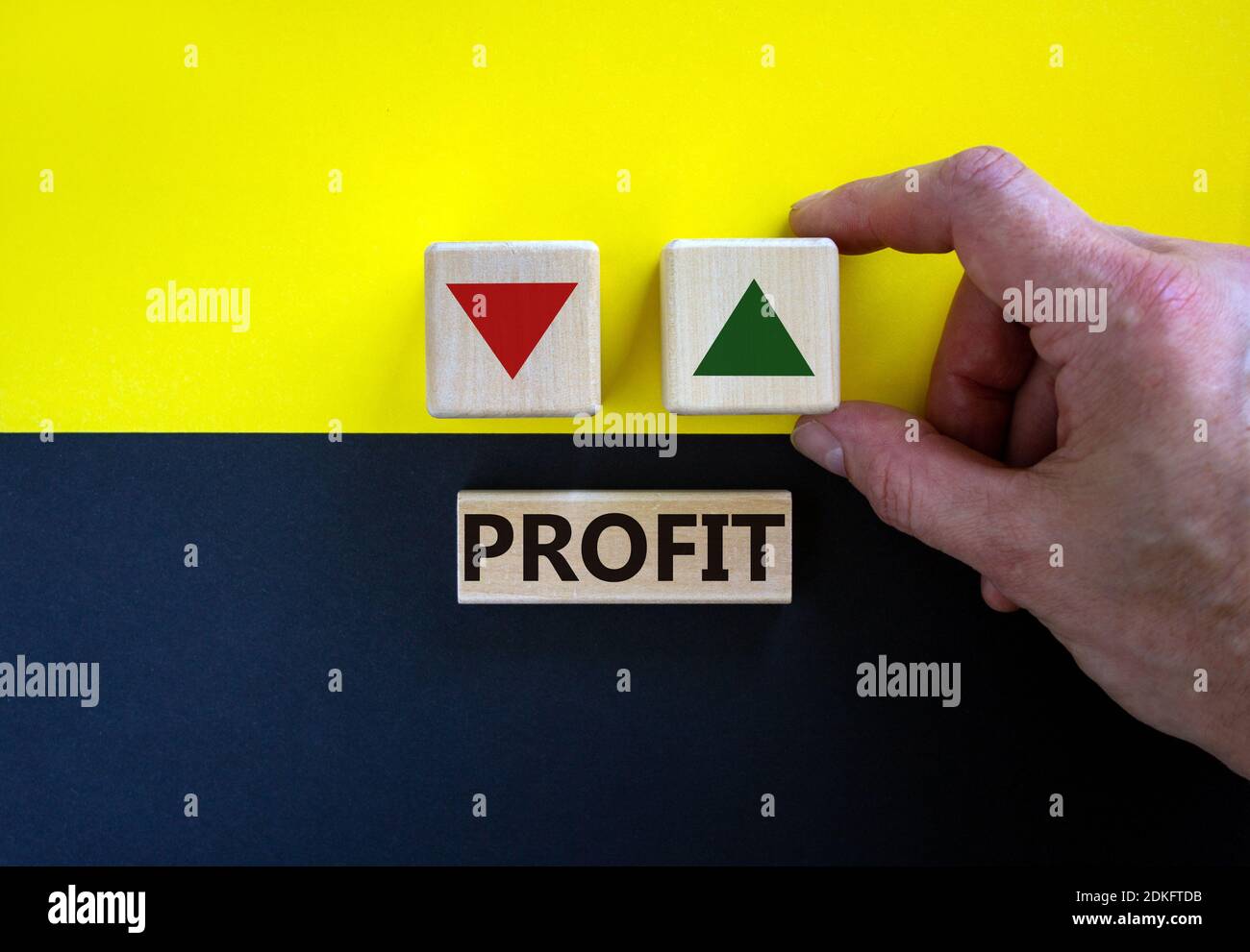 Growth of profit symbol. Businessman holds a cube with up icon. Wooden ...