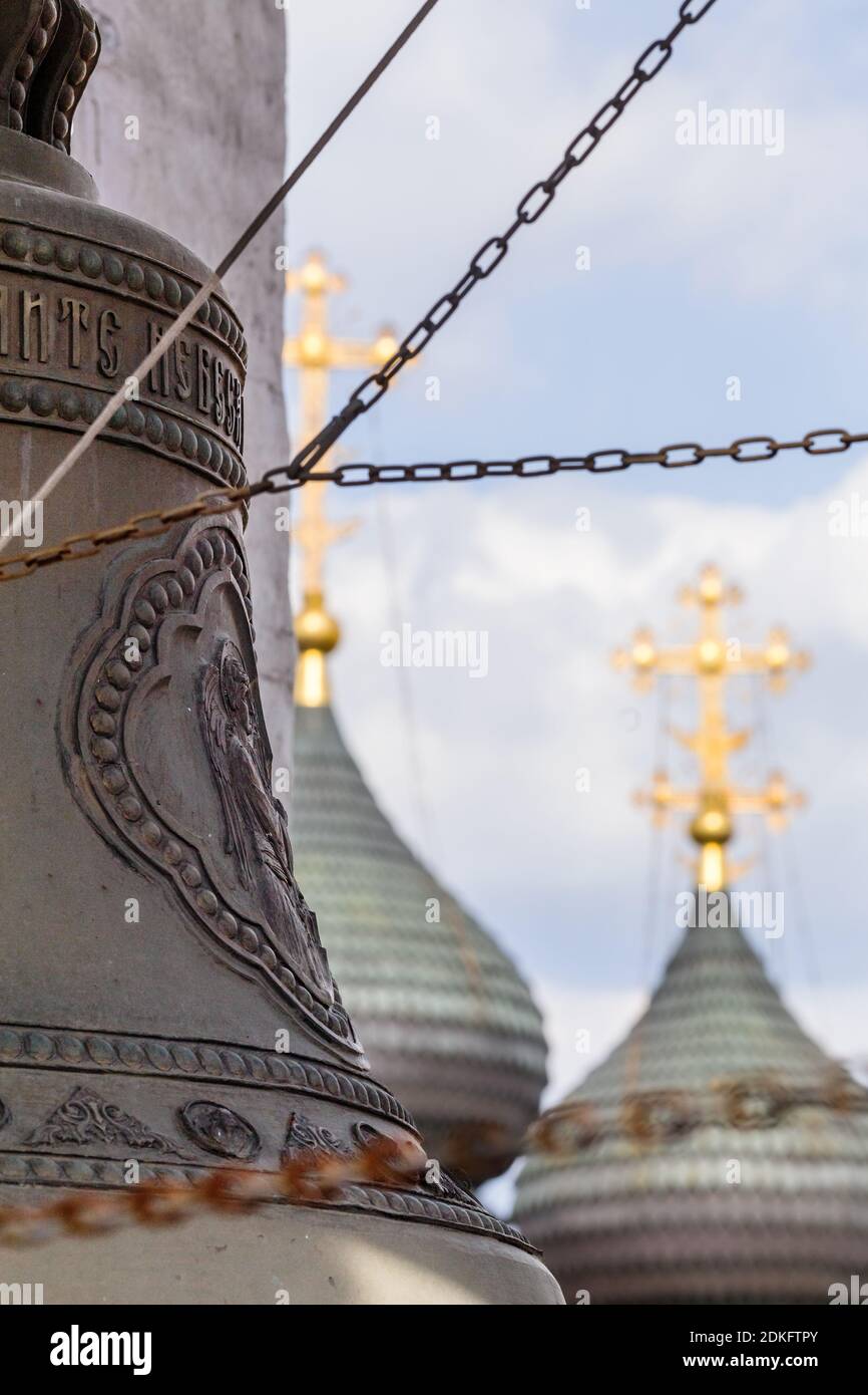 Large bell surrounded by chains of suspension and management of ...