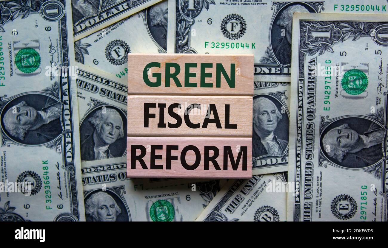 Green fiscal reform symbol. Wooden blocks with the words 'Green fiscal ...