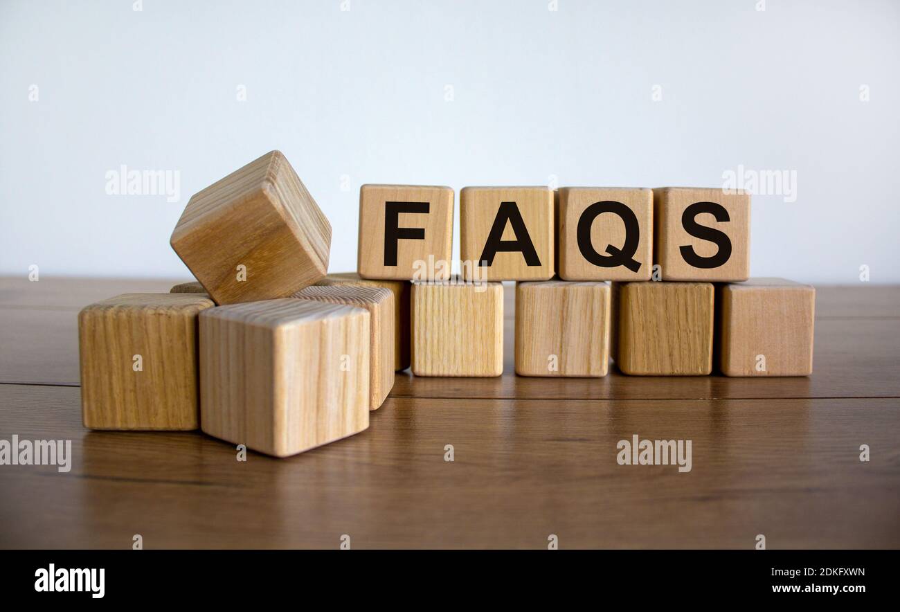 FAQS symbol. Wood cubes with word 'FAQS - frequently asked questions ...