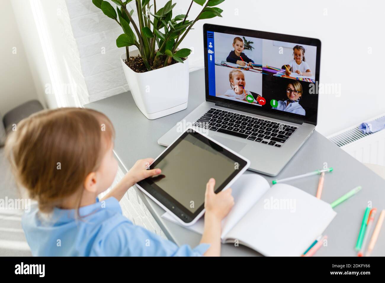 Remote lessons. The child smiles happily and gets knowledge remotely ...