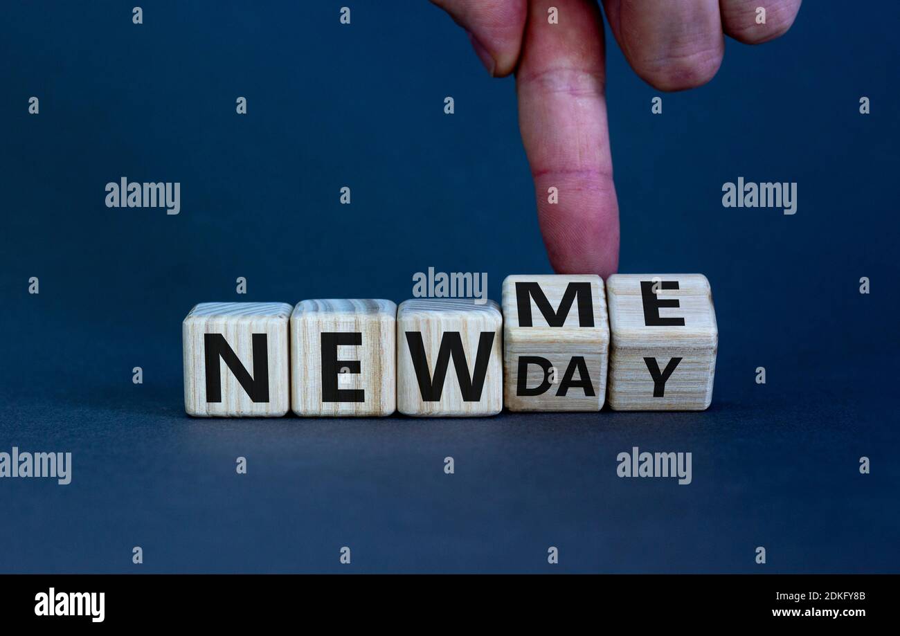 New me symbol. Hand turns cubes and changes words 'new day' to 'new me ...