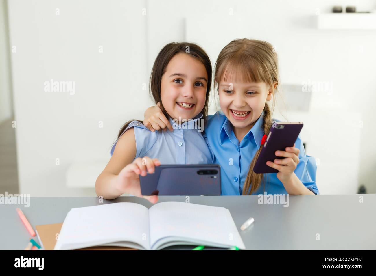 two little girls studying online. Distance Learning Online, e-learning ...
