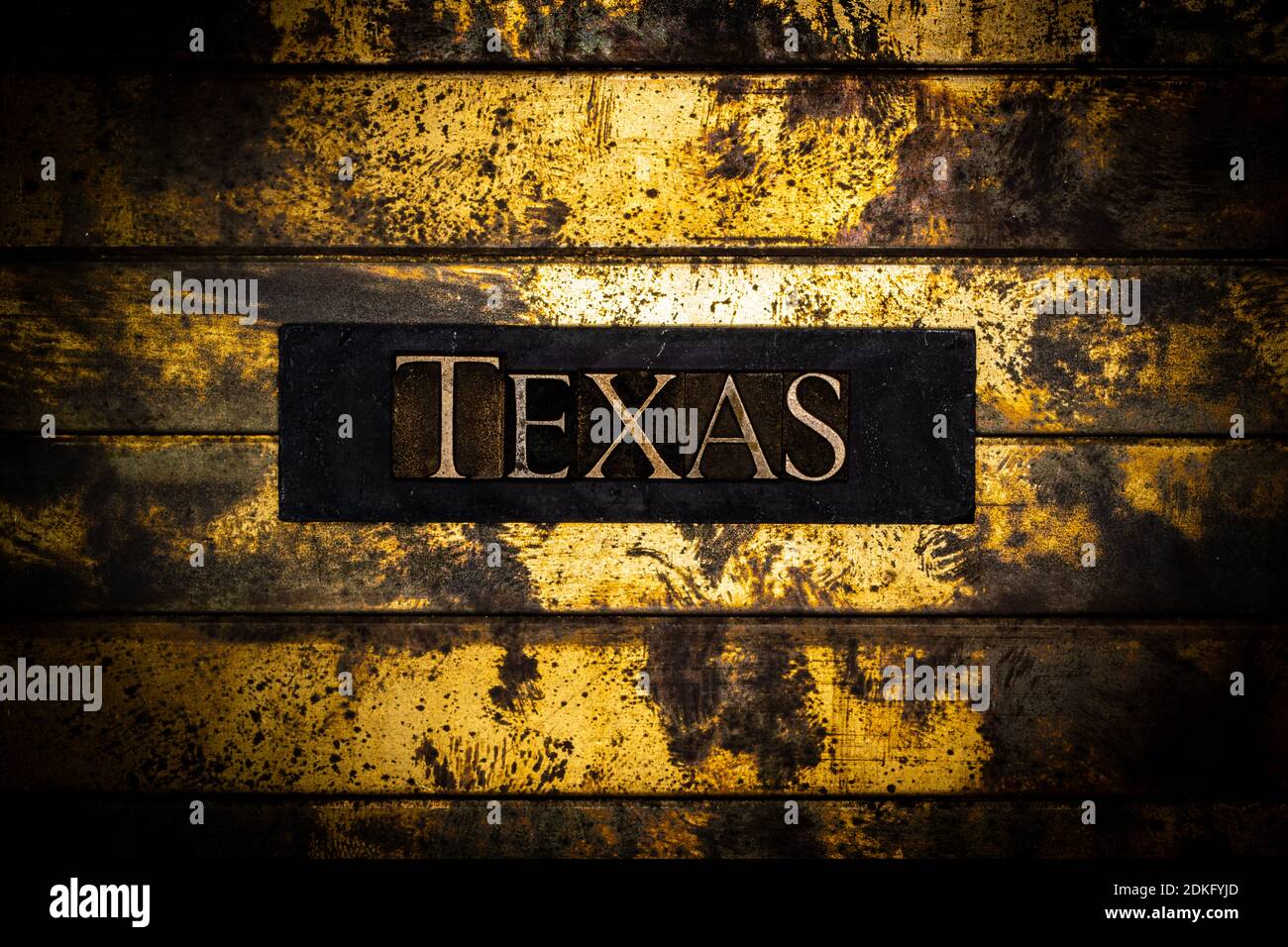Texas text on sand colored grunge textured copper and gold background ...