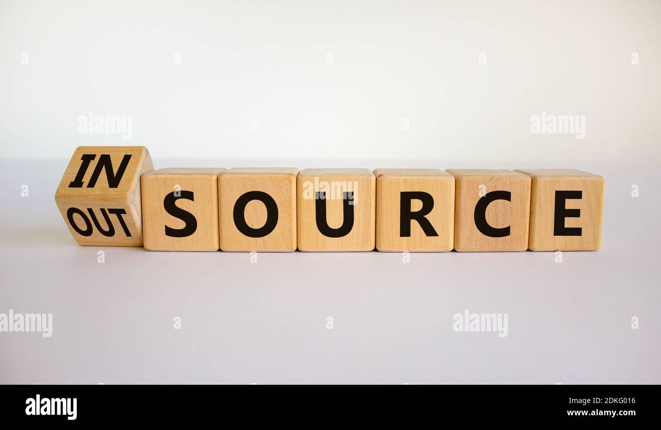 Outsource or insource symbol. Fliped wooden cubes and changed the word ...