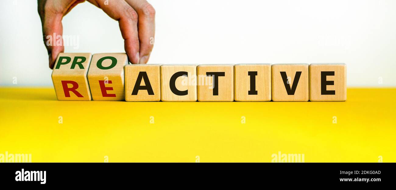 Reactive or proactive symbol. Businessman hand turns cubes and changes ...
