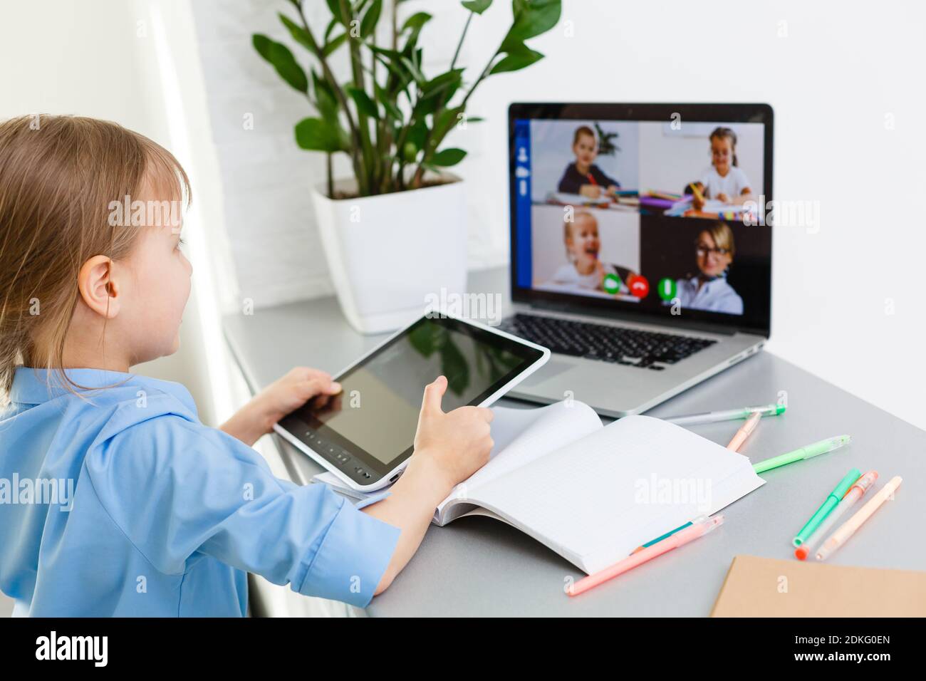 Remote lessons. The child smiles happily and gets knowledge remotely ...