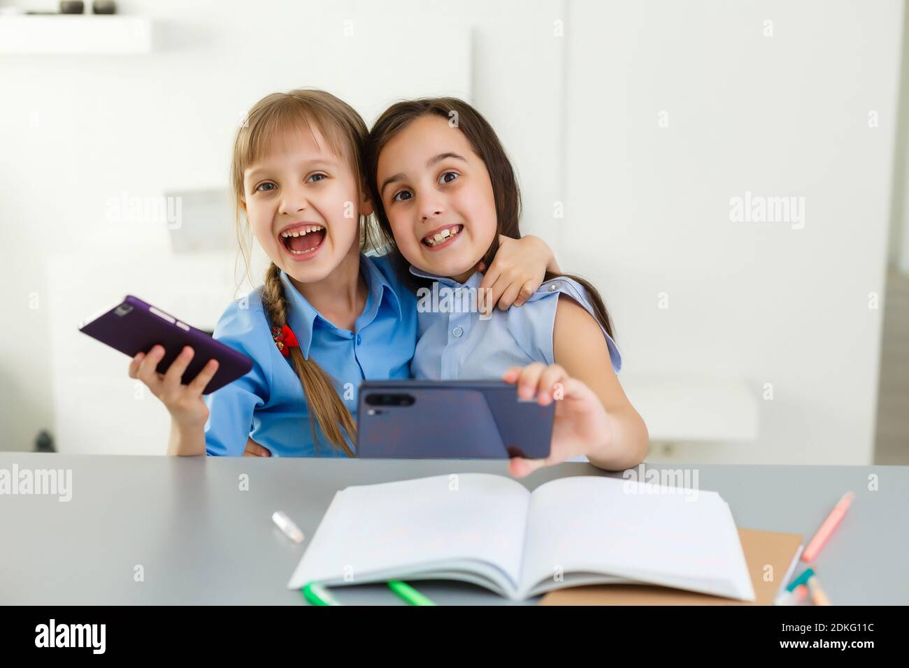 two little girls studying online. Distance Learning Online, e-learning ...