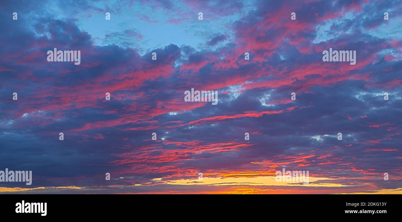 fantastic play of colors and shades of violet, scarlet cloudy sky at ...
