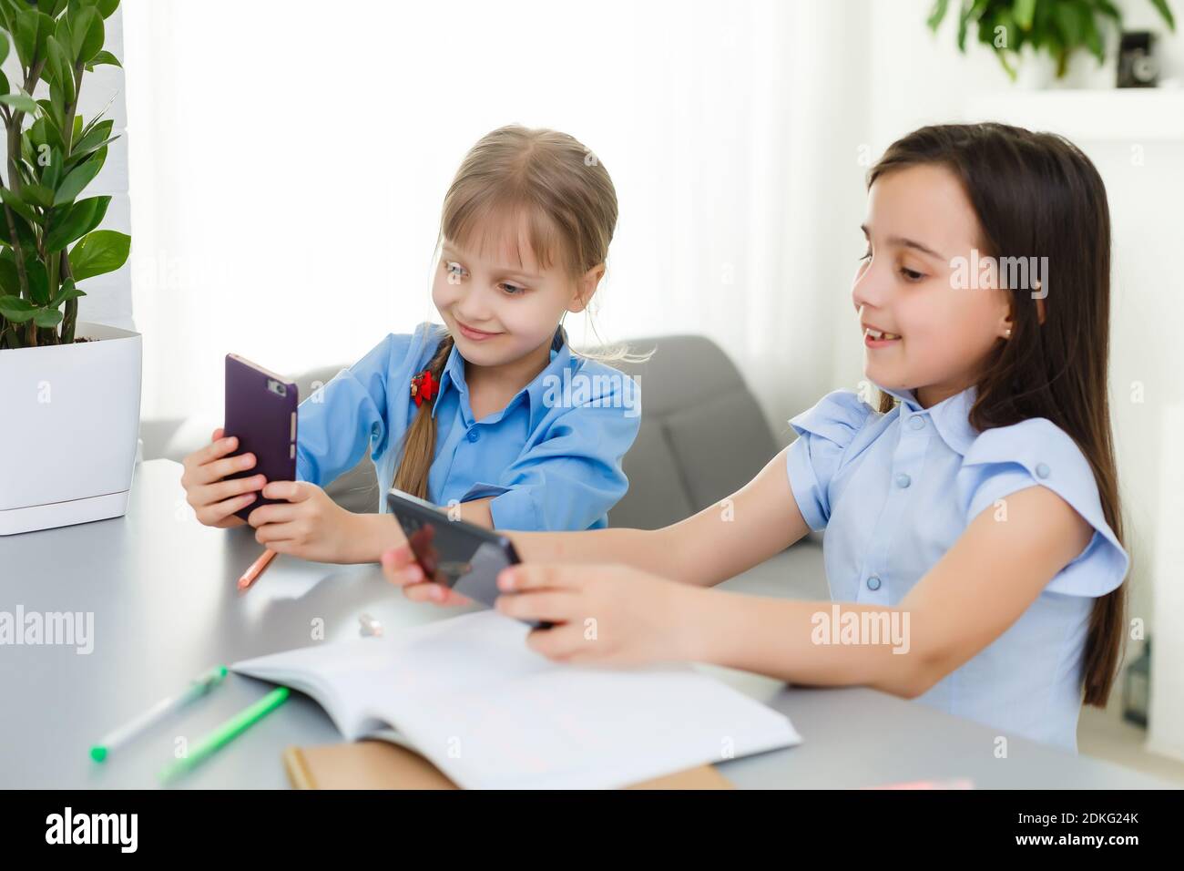 two little girls studying online. Distance Learning Online, e-learning ...