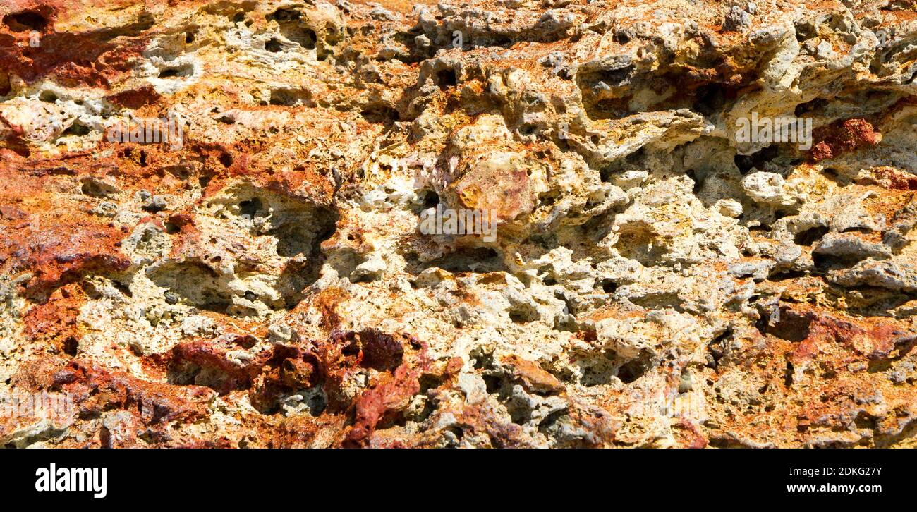 Patterns on the coastal cliffs of red sandstone (Arabian sea coastline ...
