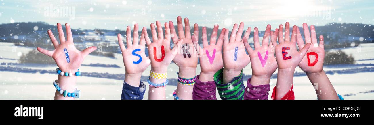 Kids Hands Holding Word I Survived, Snowy Winter Background Stock Photo ...