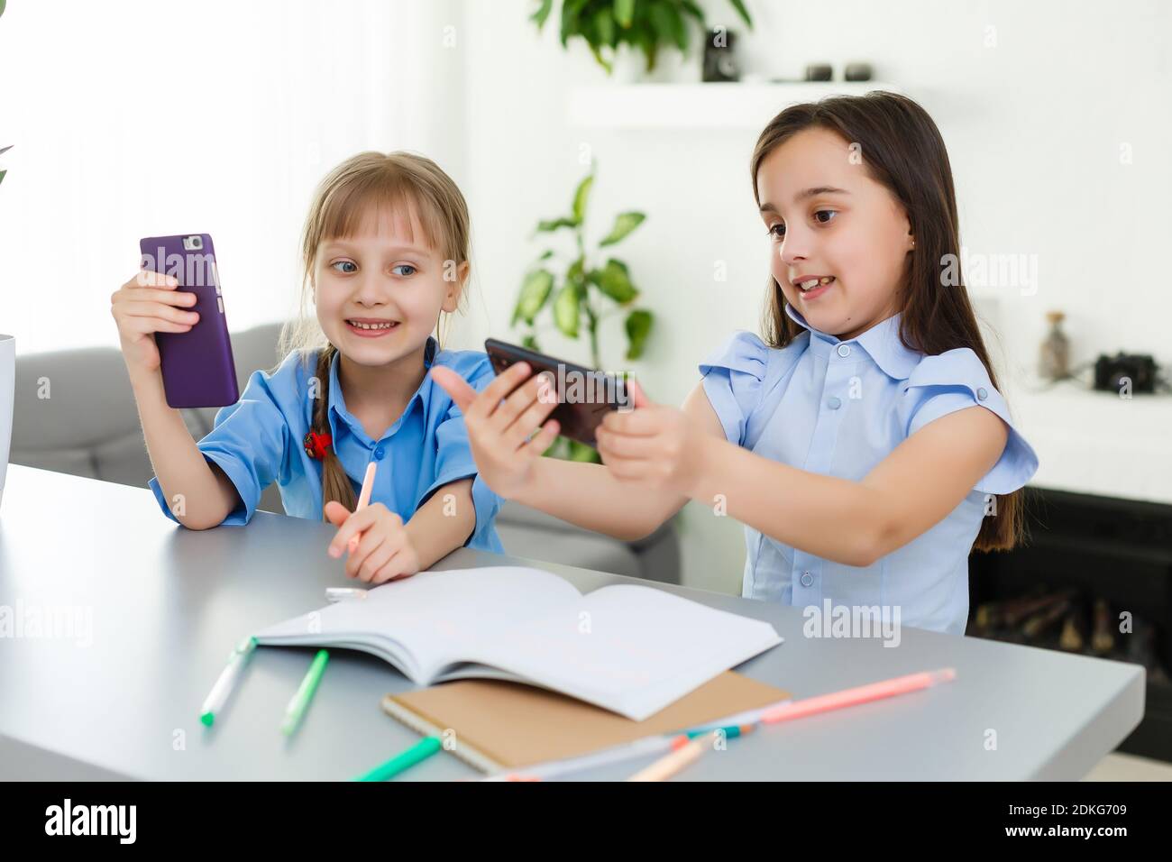 two little girls studying online. Distance Learning Online, e-learning ...