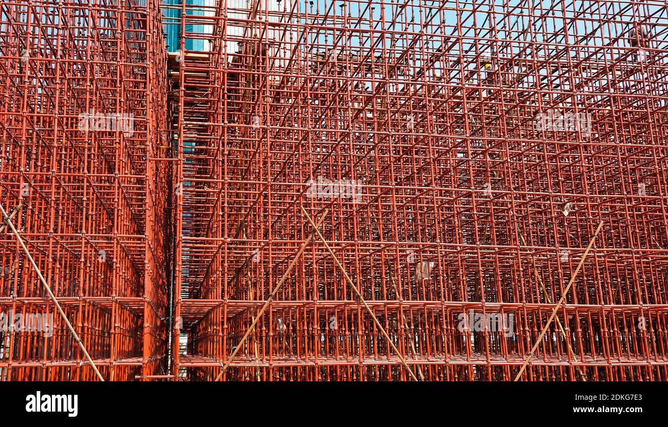 Huge, brown scaffolding against blue sky background. Shanghai, China ...