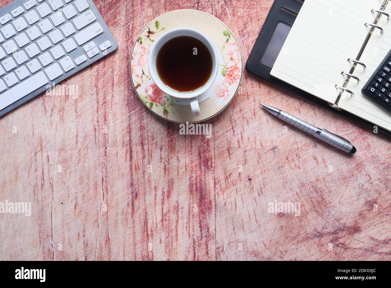 office desk with keyboard and notepad on wooden desk top down Stock ...