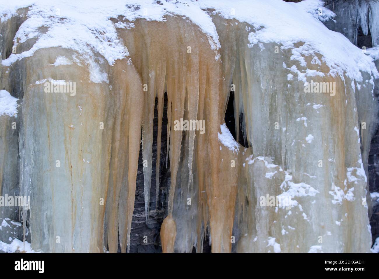Frozen waterfall with icicles on the roadside in wintry Norway / Troms ...
