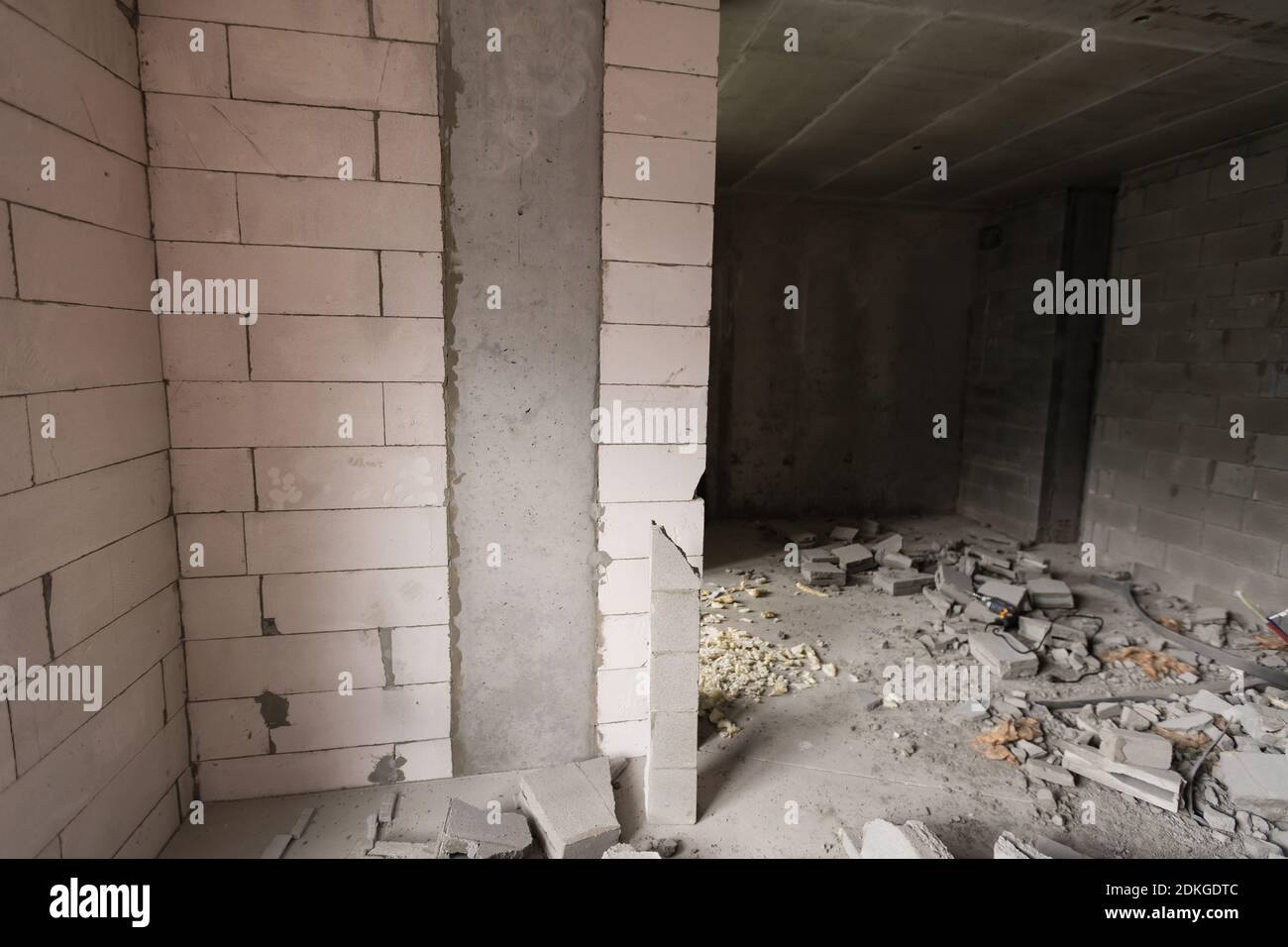 Wall smashed into debris room in apartment ready for renovation with ...
