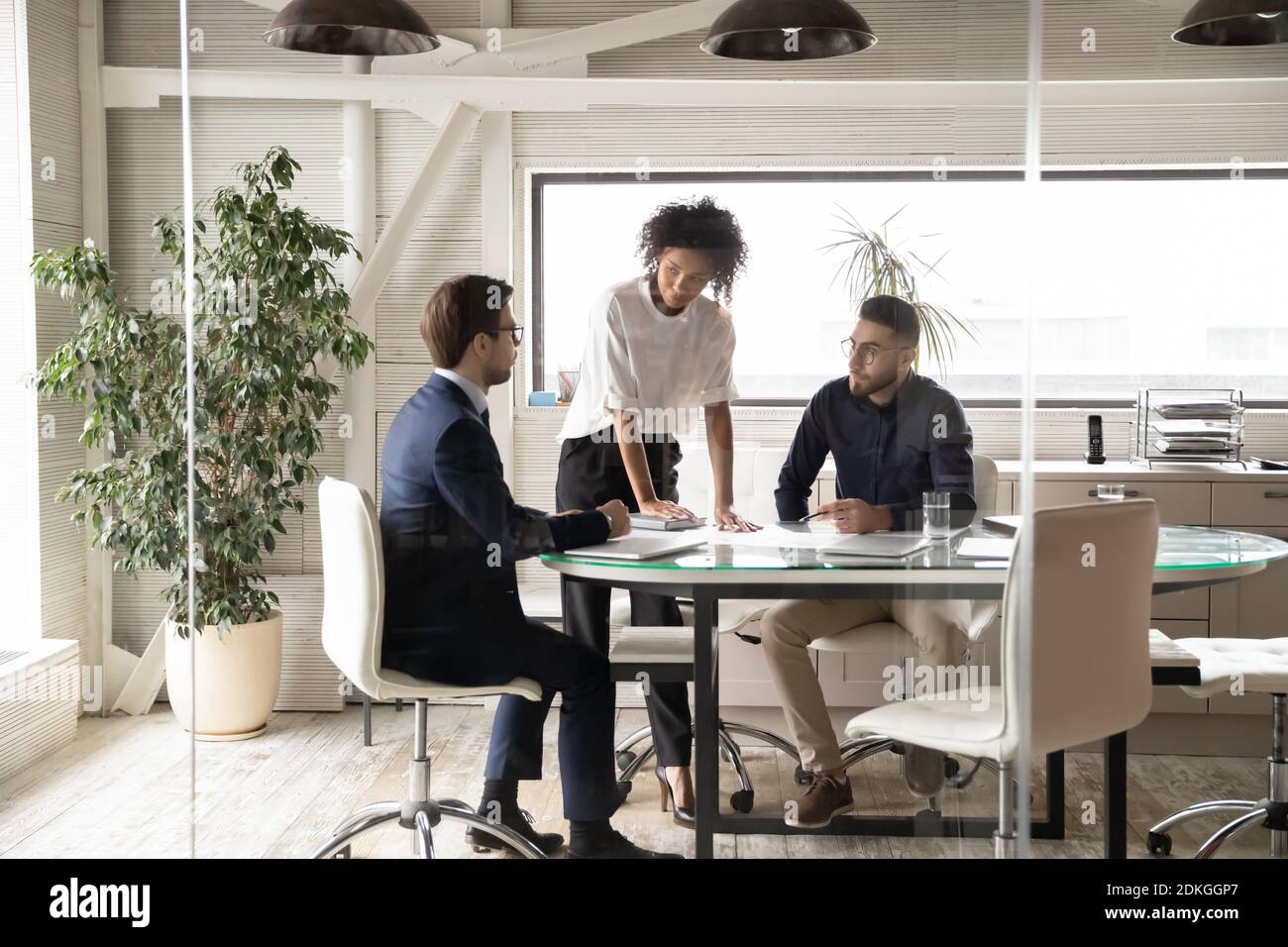 Colleagues talk work in business hi-res stock photography and images ...