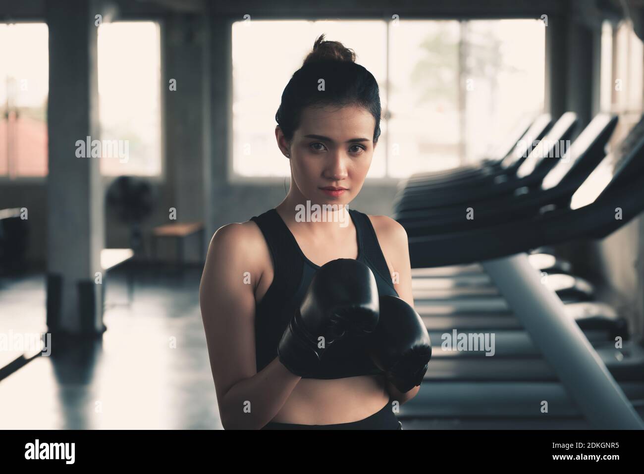 Attractive asian female boxer training hi-res stock photography and ...