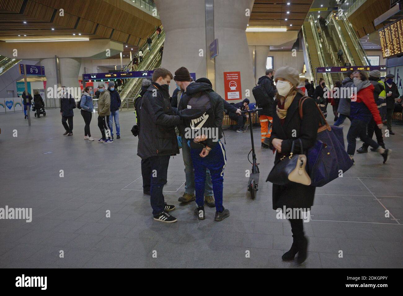 London (UK), 15 December 2020: British Transport police handcuff and ...