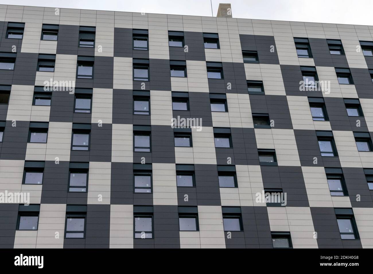 Front view from below on facade of a new modern building. Costruction ...