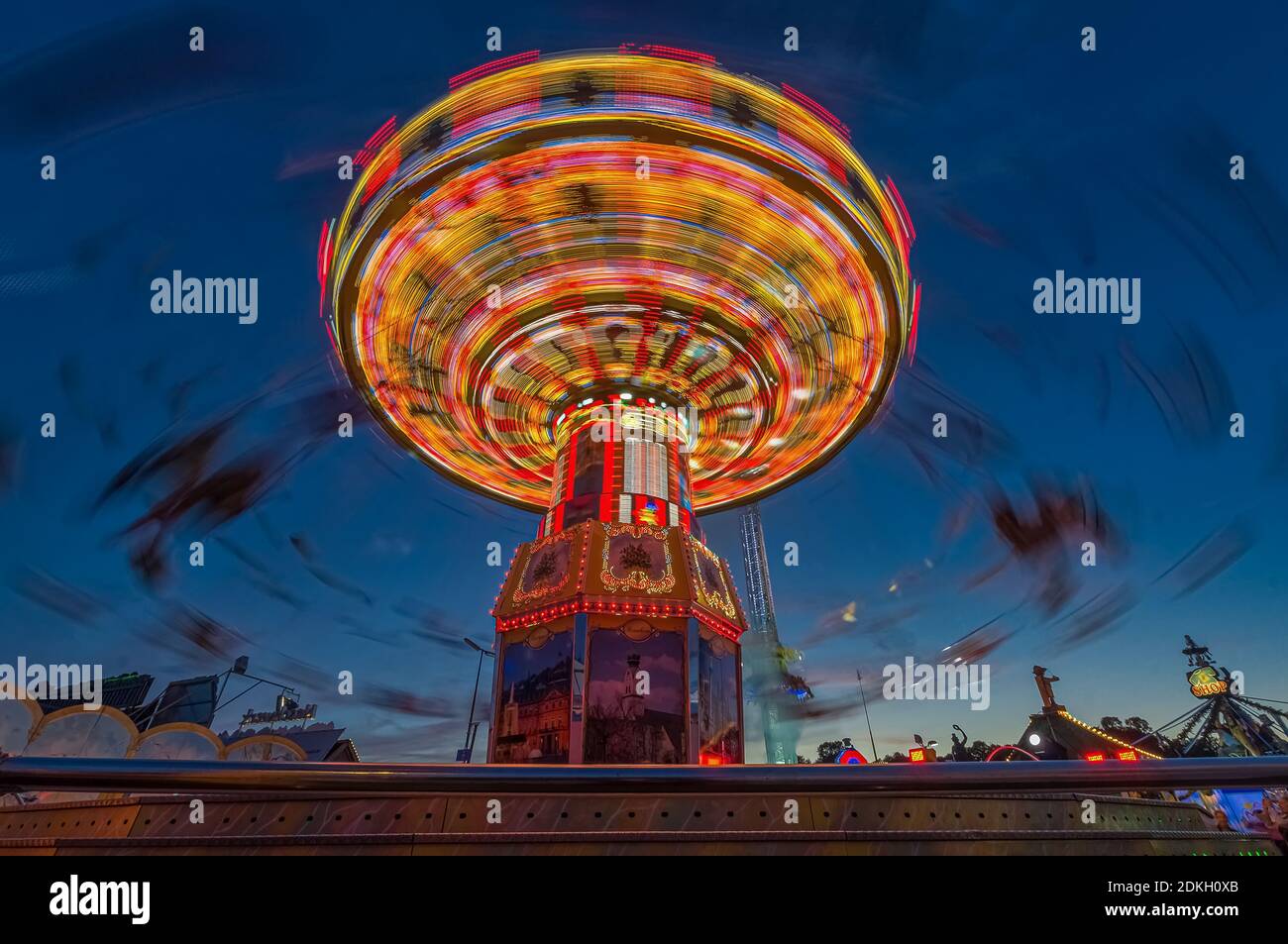Chain carousel ride at blue hour from lower perspective Stock Photo - Alamy