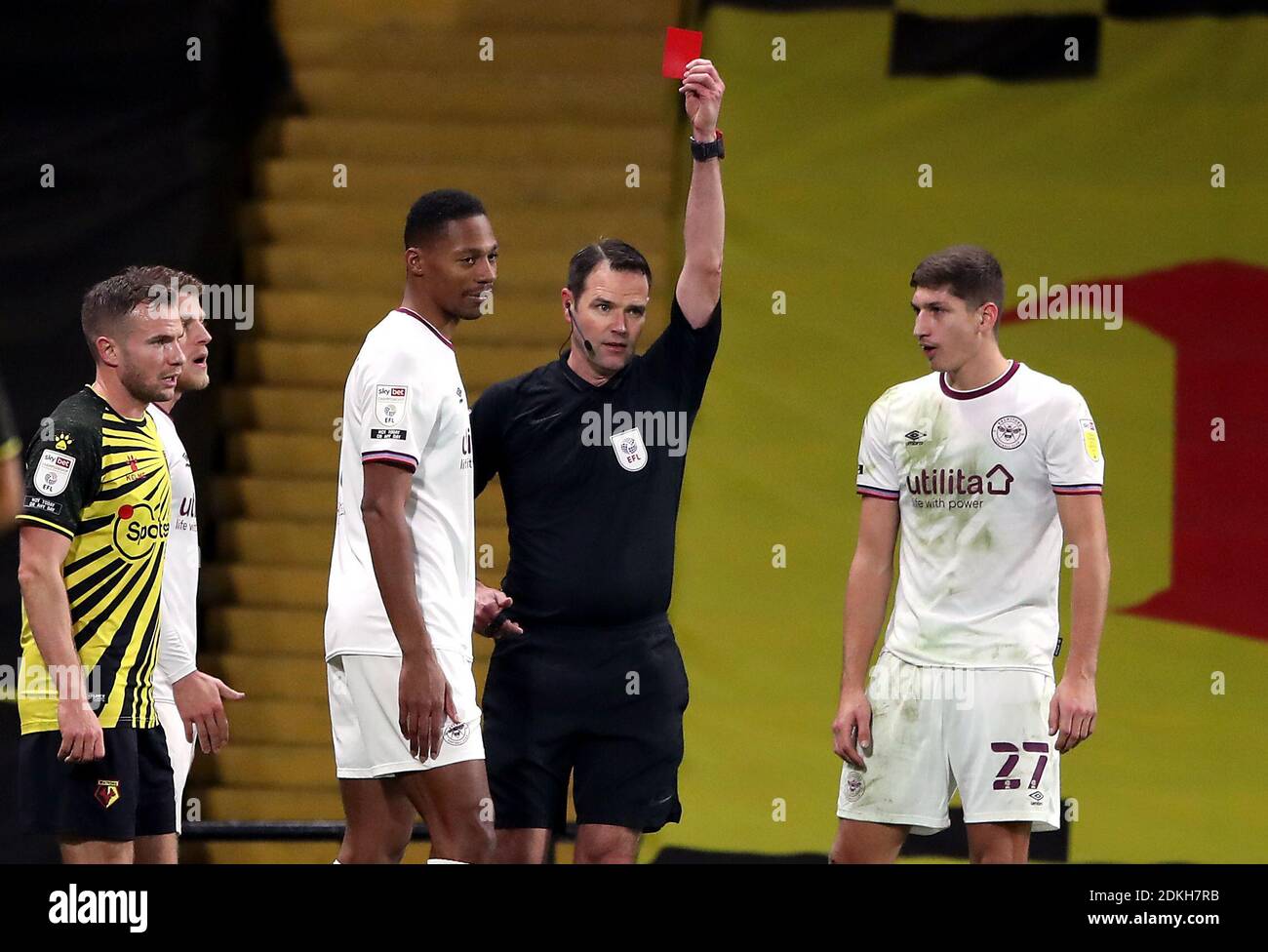 Brentford's Ethan Pinnock is shown a red card by referee James ...