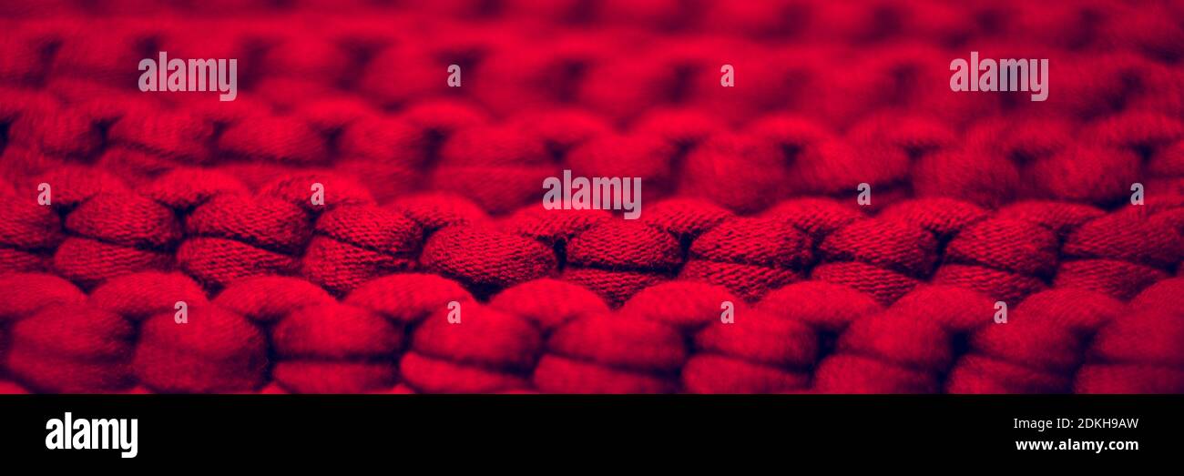 red background large knitted thread pattern Stock Photo - Alamy