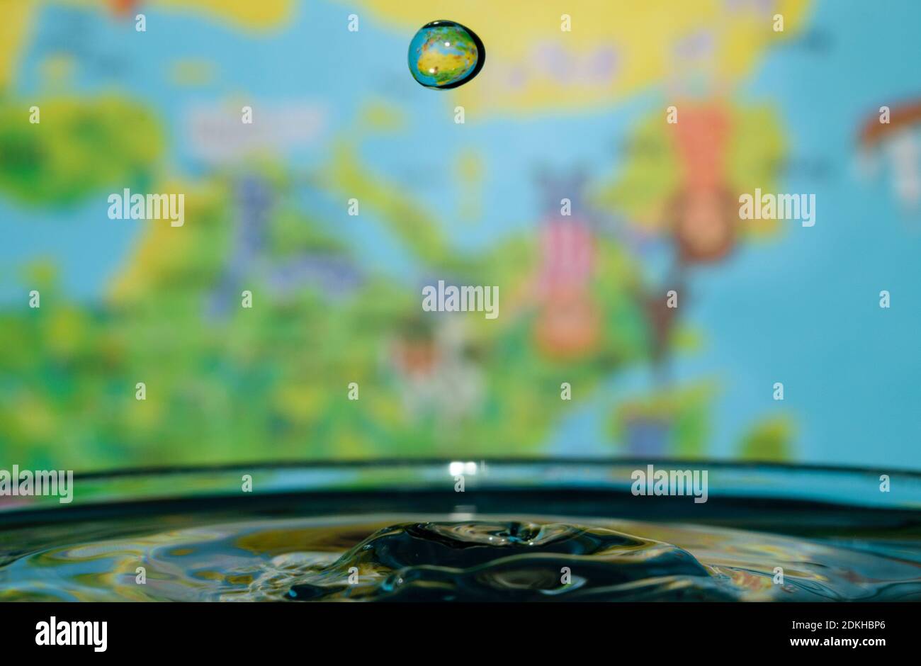 Planet Earth refracted in a water drop Stock Photo - Alamy