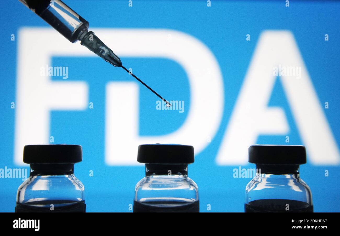 In this photo illustration, vials and a medical syringe seen displayed ...