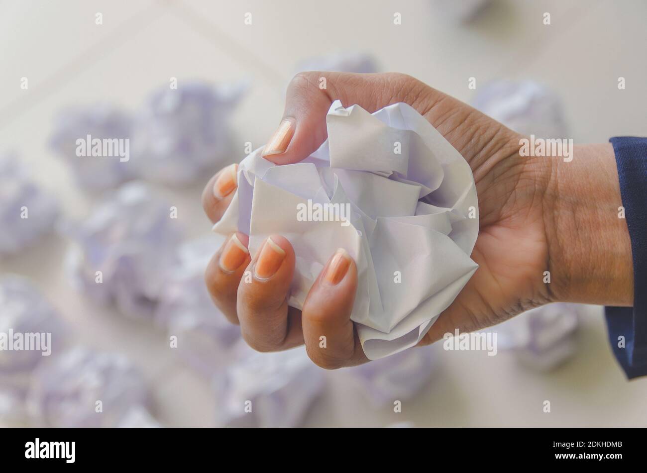 Hand Crumpling High Resolution Stock Photography and Images - Alamy