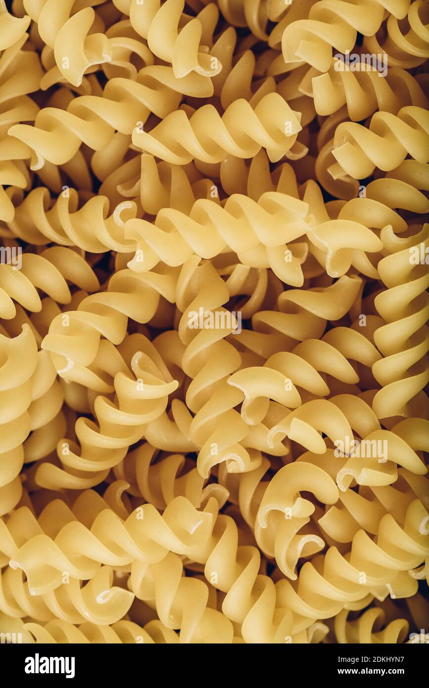 Background of Italian whole wheat corkscrew shaped pasta Stock Photo ...