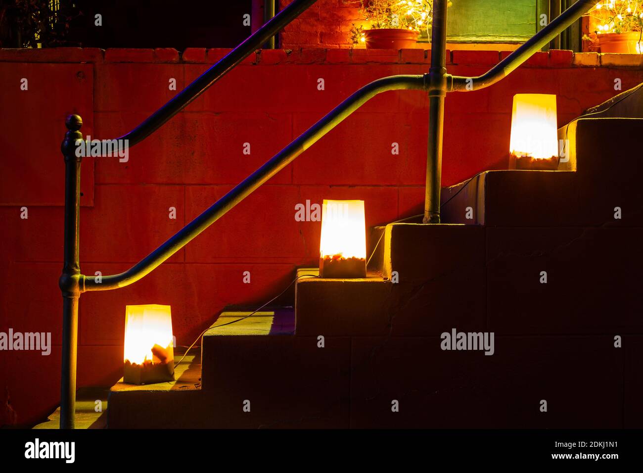 Luminaries glowing at night and set up on stairs to guide visitors ...
