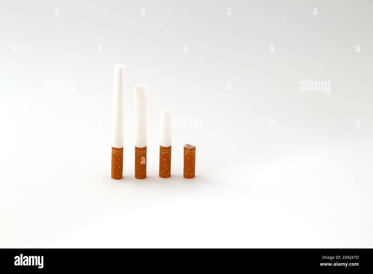 Nicotine addiction, a lot of cigarettes on a white isolated background ...