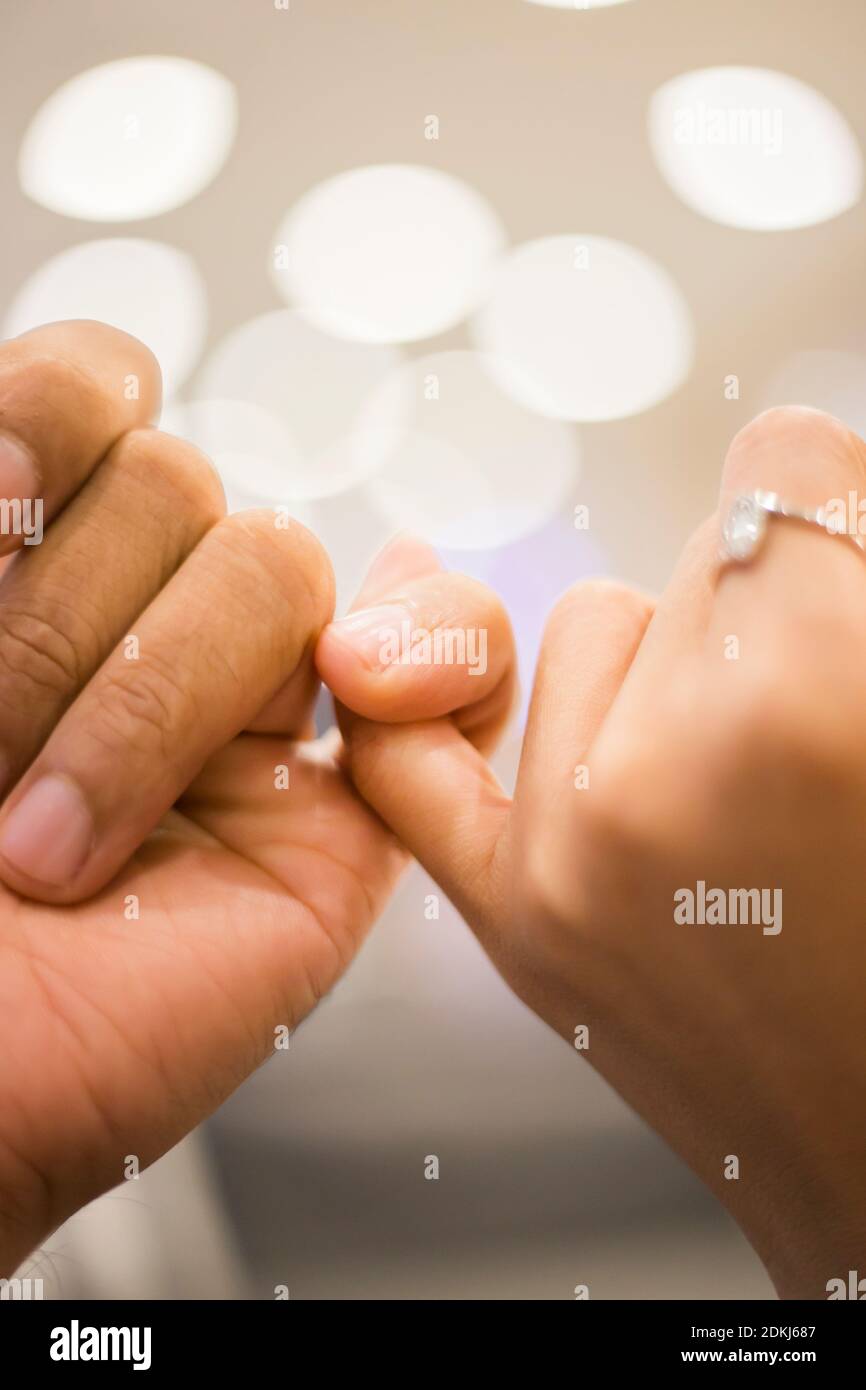 Finger hooking hi-res stock photography and images - Alamy