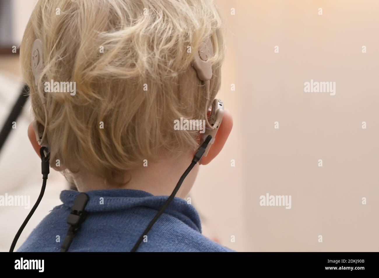 Wearing hearing aid hi-res stock photography and images - Alamy