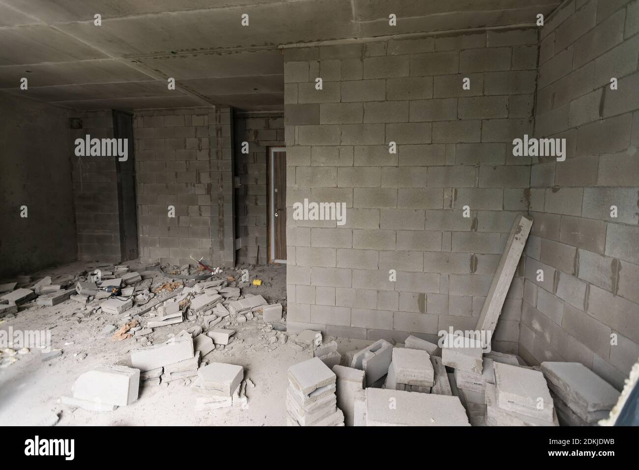 Wall smashed into debris room in apartment ready for renovation with ...
