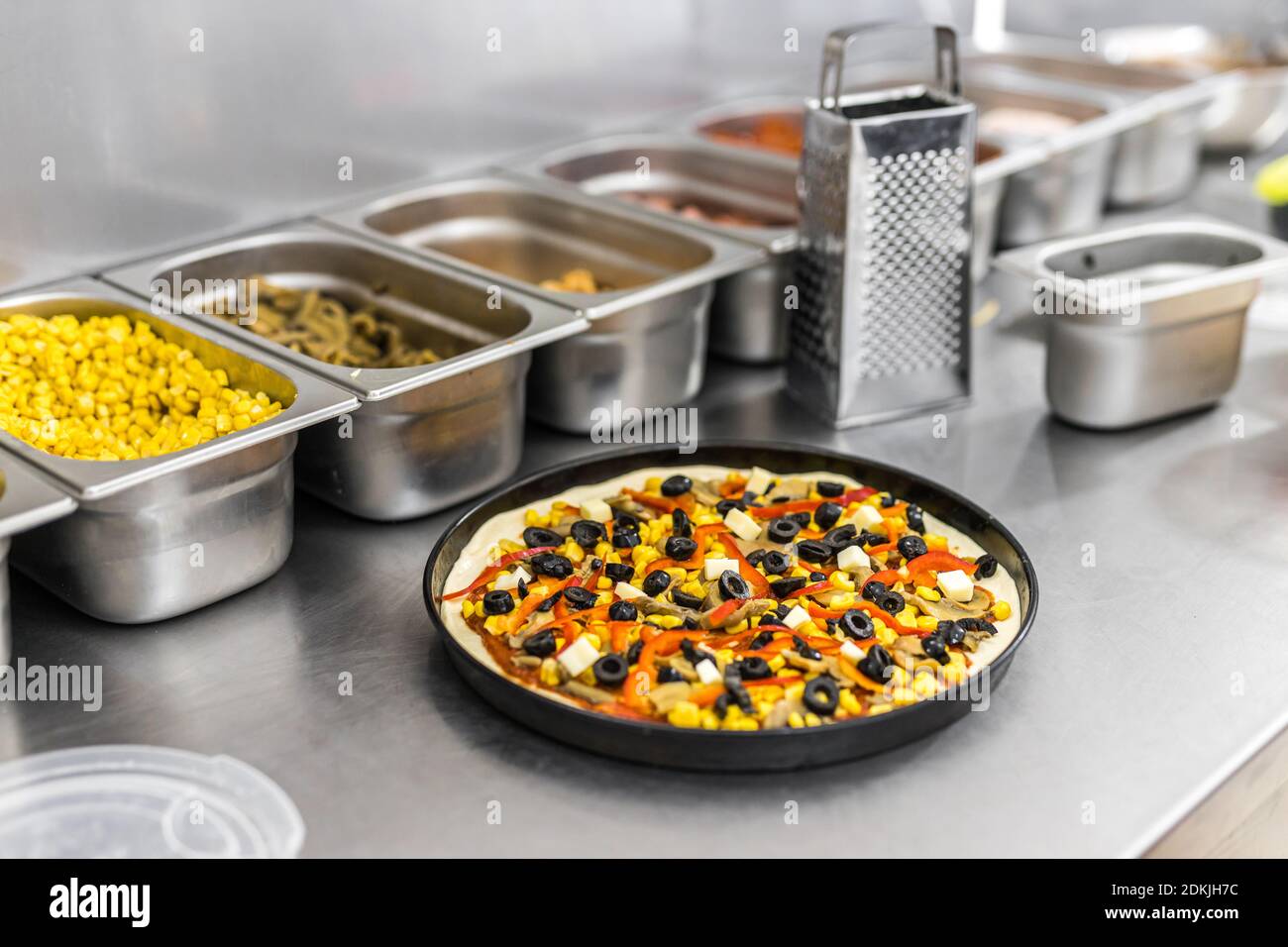 Making of a traditional italian pizza in the kitchen Stock Photo - Alamy