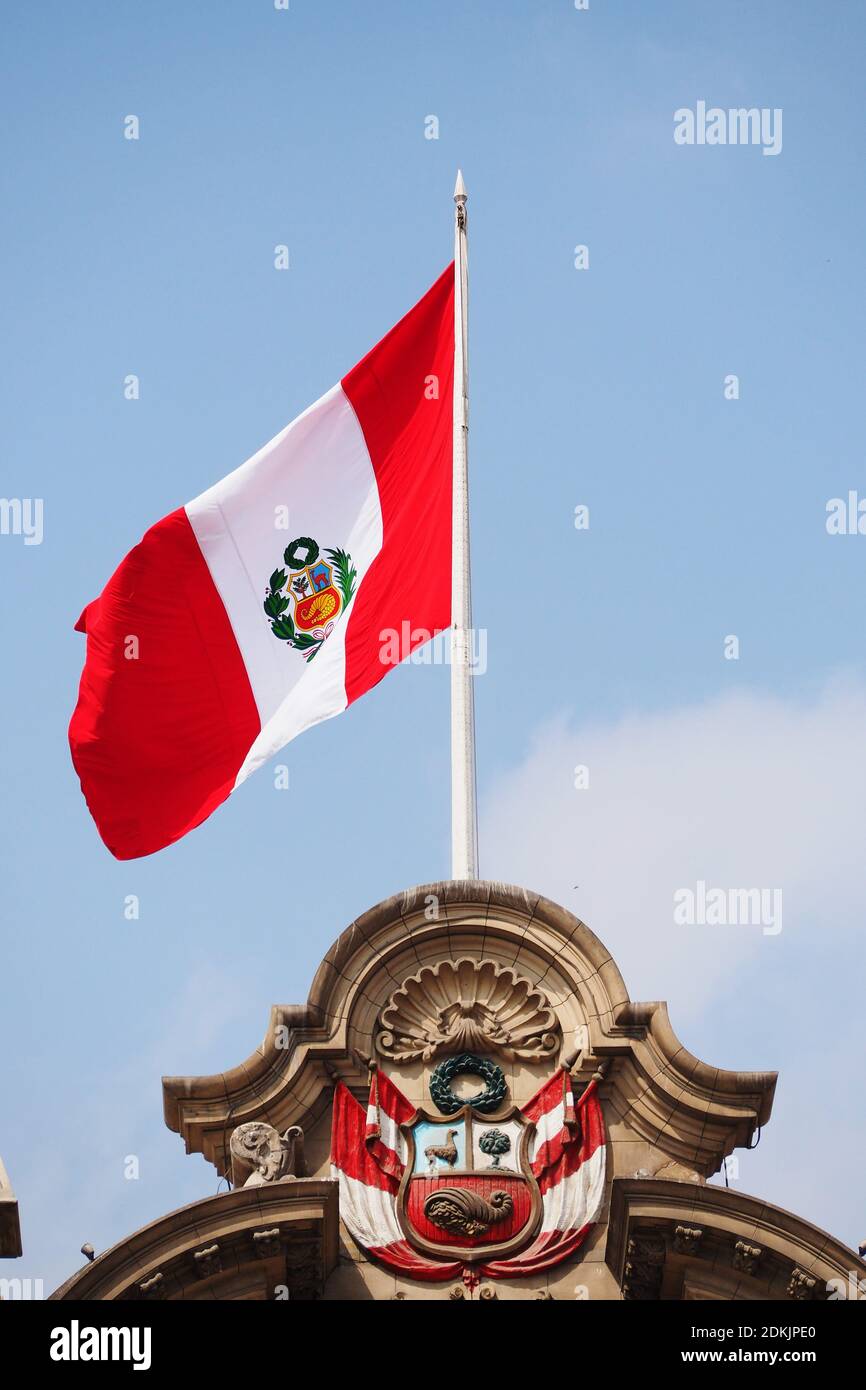 Peruvian flag waving on the top of the mast at the ceremony of awarding ...