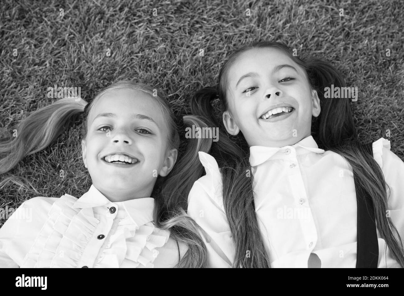 Happy childhood experience. Happy children relax on green grass ...