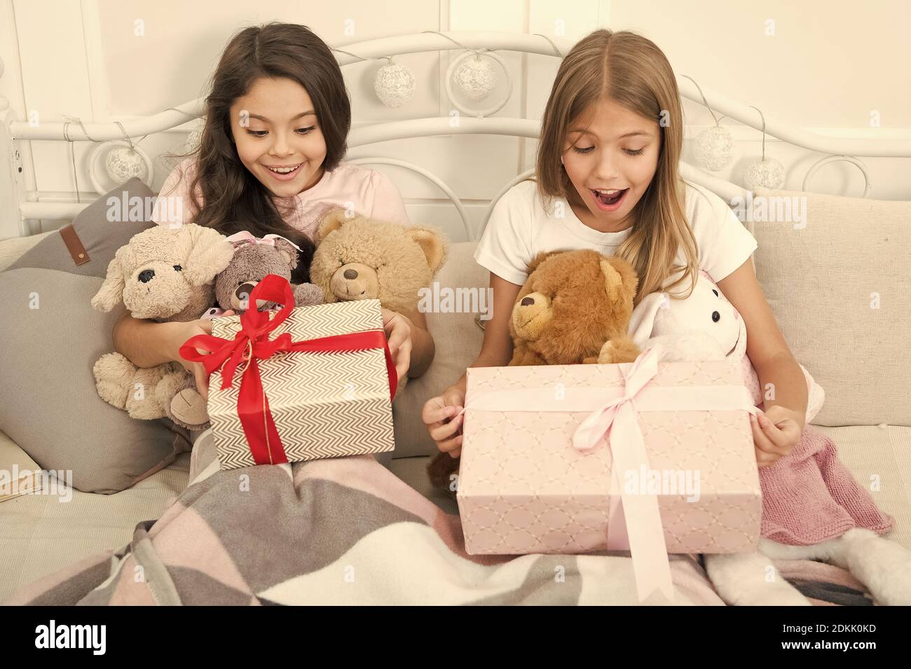 Surprise inside. Surprised children in morning. Little girls open ...