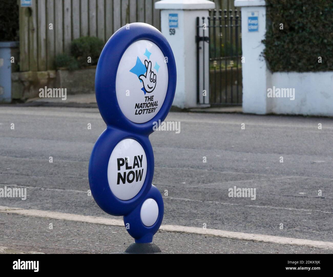 Plastic roadside pavement sign advertising the National Lottery and its ...