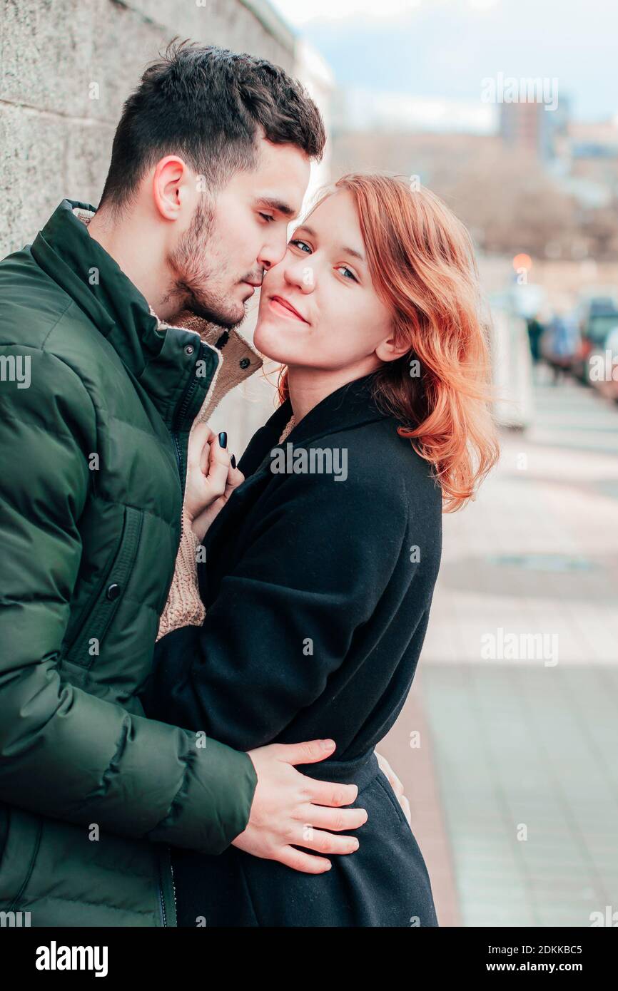 Happy Loving Couple Smiling and Hugging on the Street. Two Happy People ...